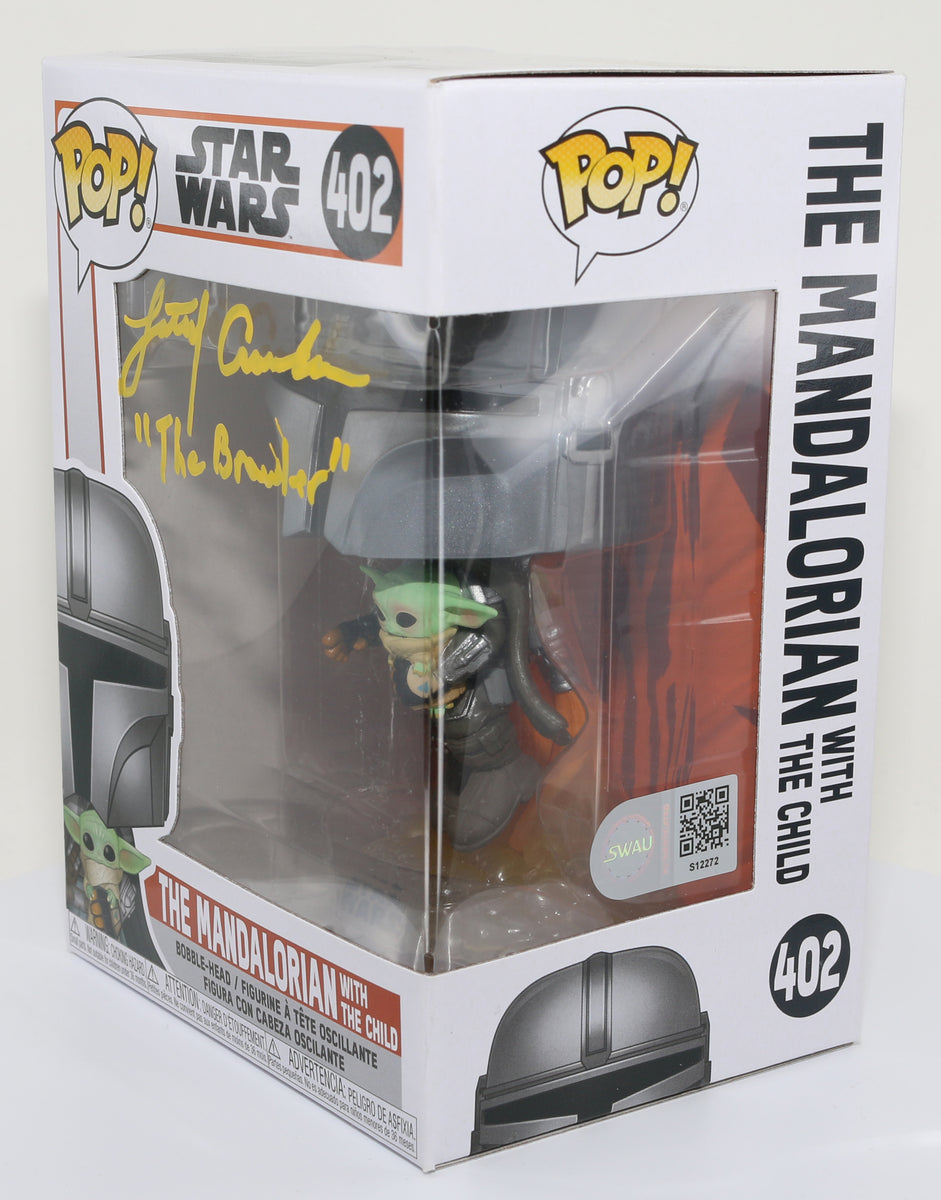 Lateef Crowder as The Mandalorian with The Child in Star Wars: The Man ...